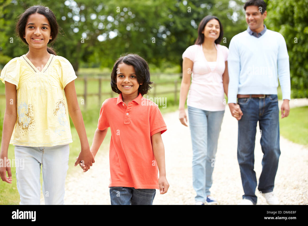 Indian Family Walking In Countryside Stock Photo - Alamy