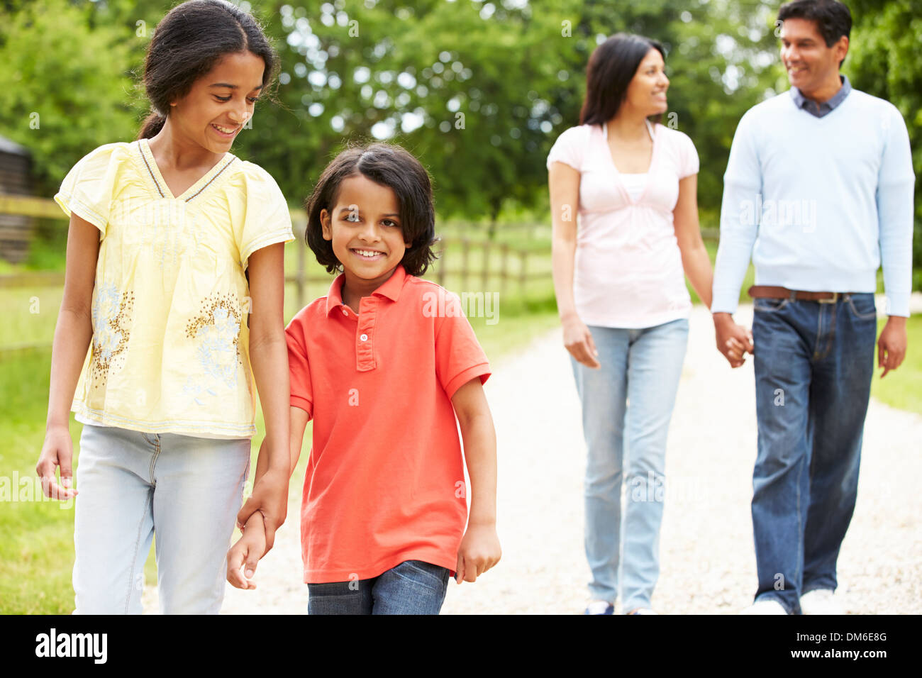 Indian family walking hi-res stock photography and images - Alamy