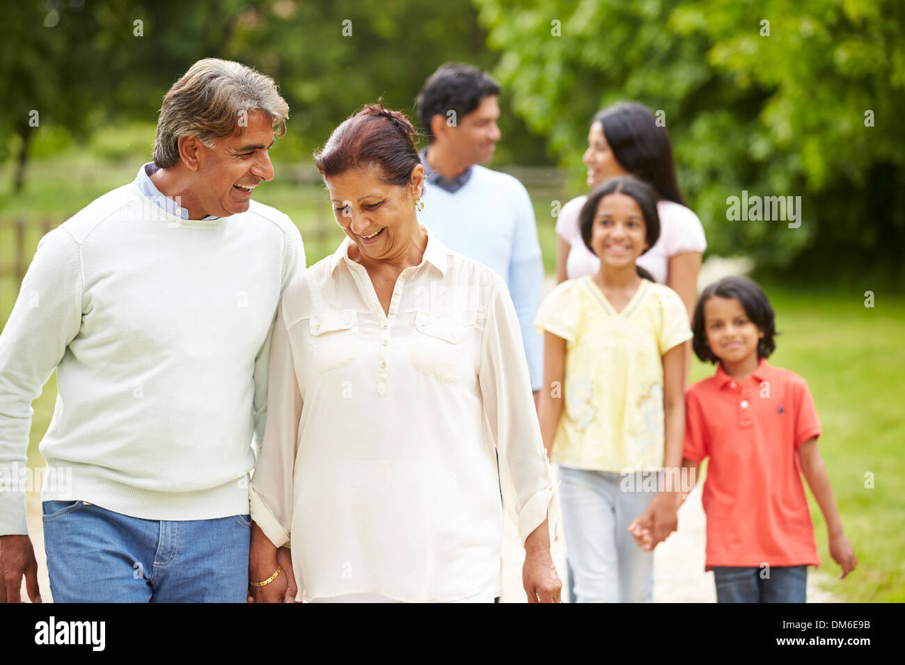 Indian family walking hi-res stock photography and images - Alamy