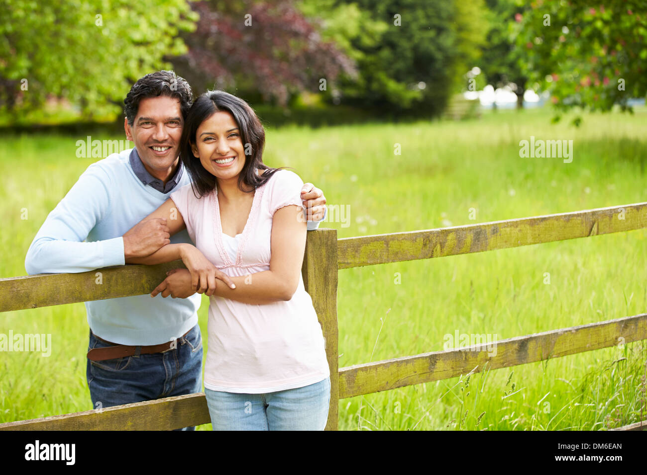 Indian Couple Walking In Countryside Stock Photo - Alamy
