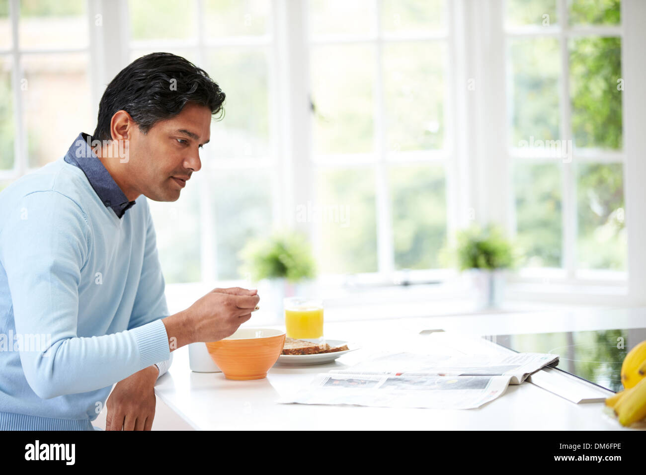 Indian man eating breakfast hi-res stock photography and images - Alamy