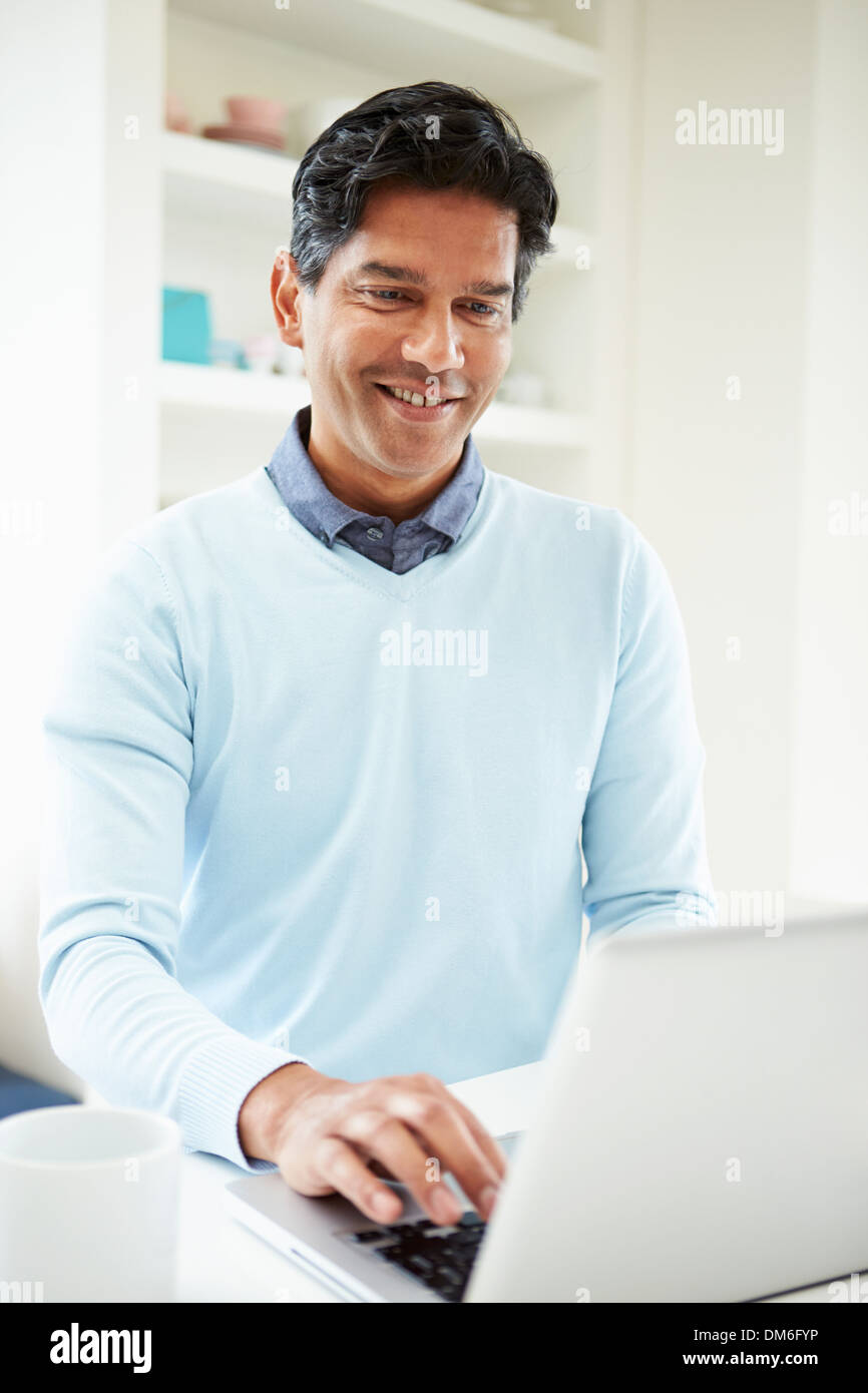 Indian man using laptop home hi-res stock photography and images - Alamy