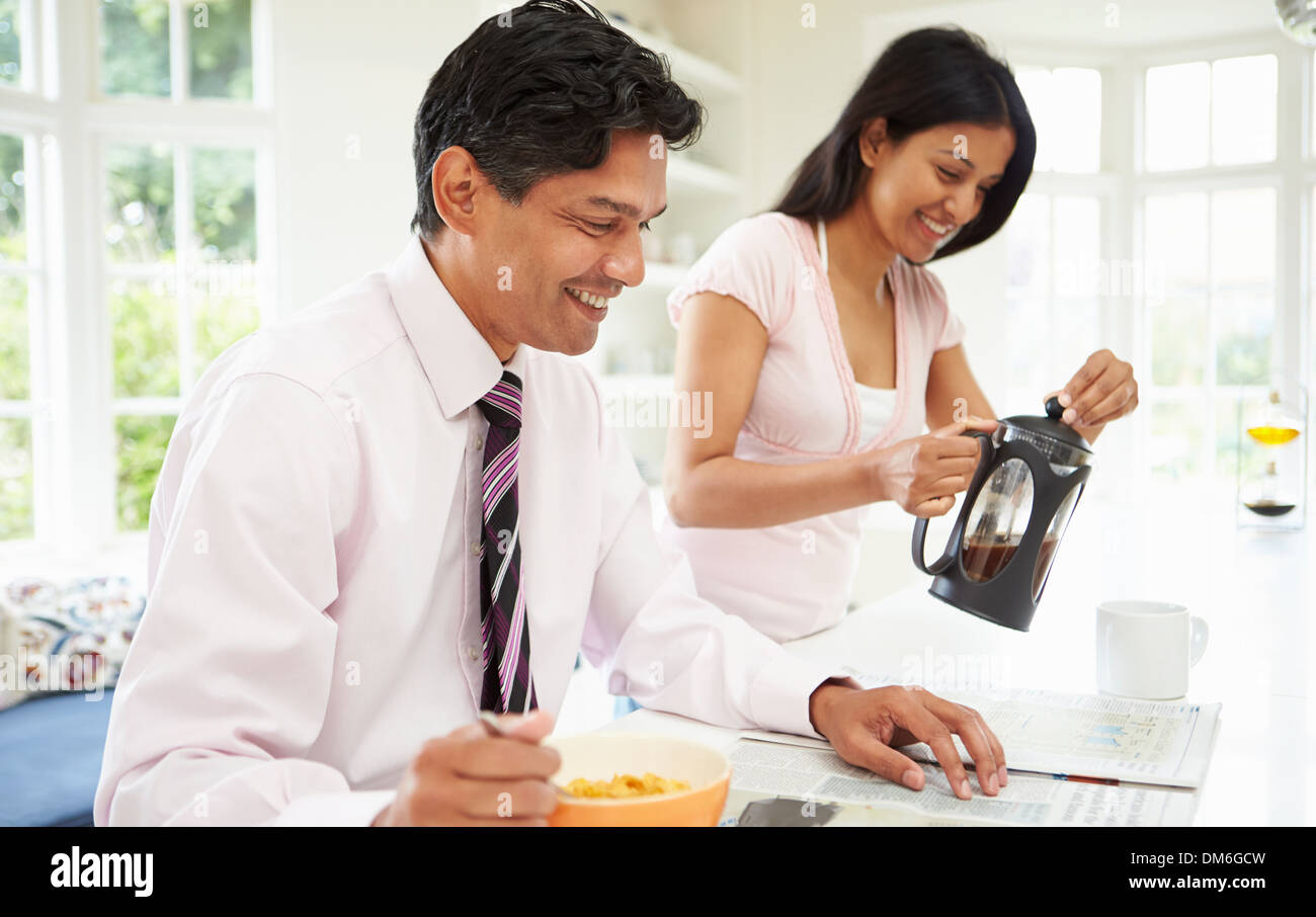 Before work or while you are reading the morning newspaper hi-res stock ...