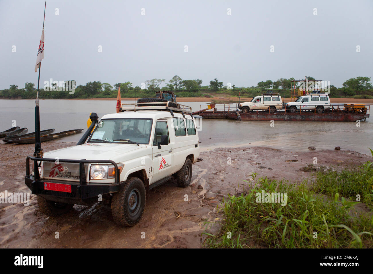 Cars of MSF crossing a river in central african republic Stock Photo ...