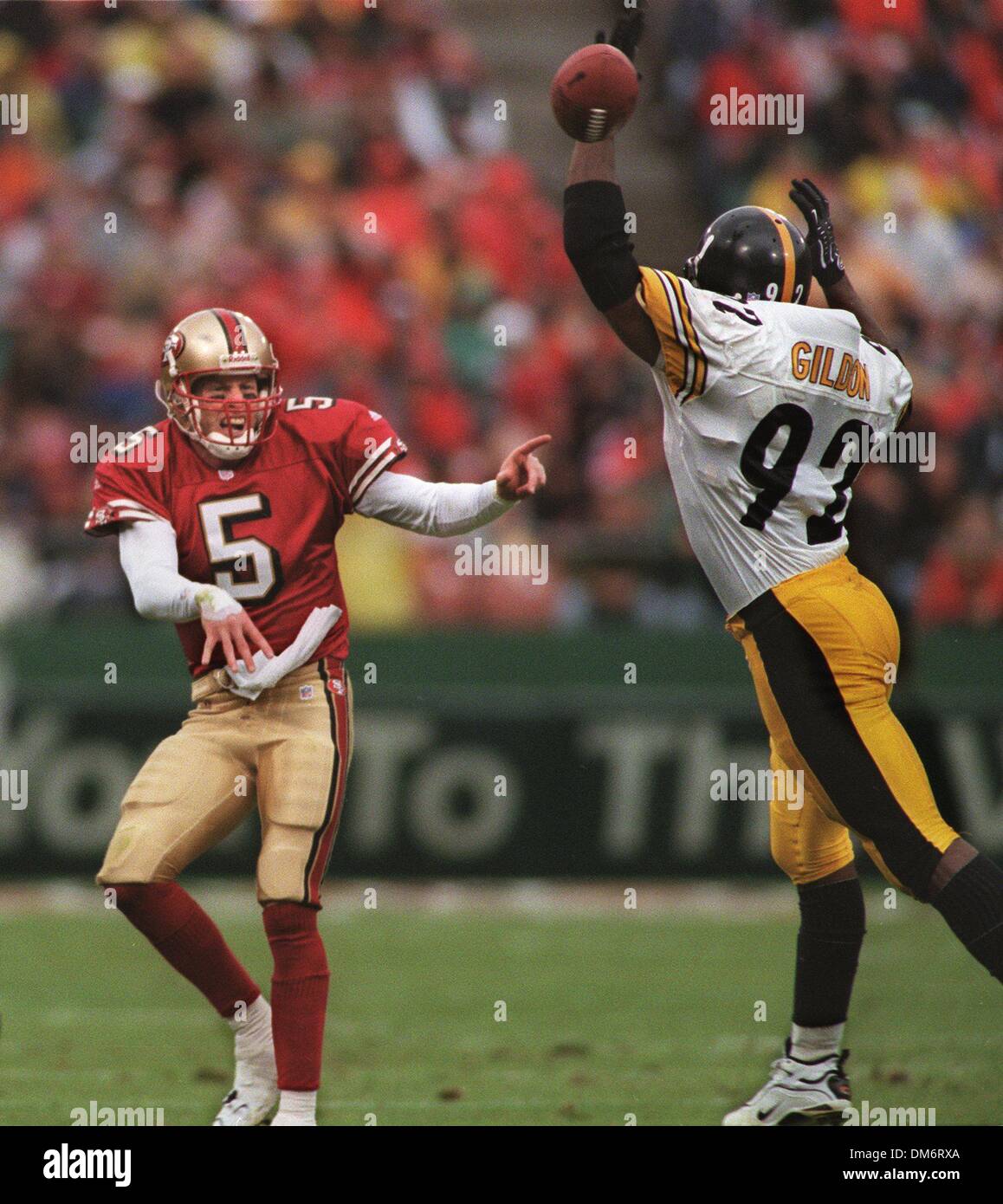San Francisco 49ers quarterback Jeff Garcia (5) barely gets off a pass ...