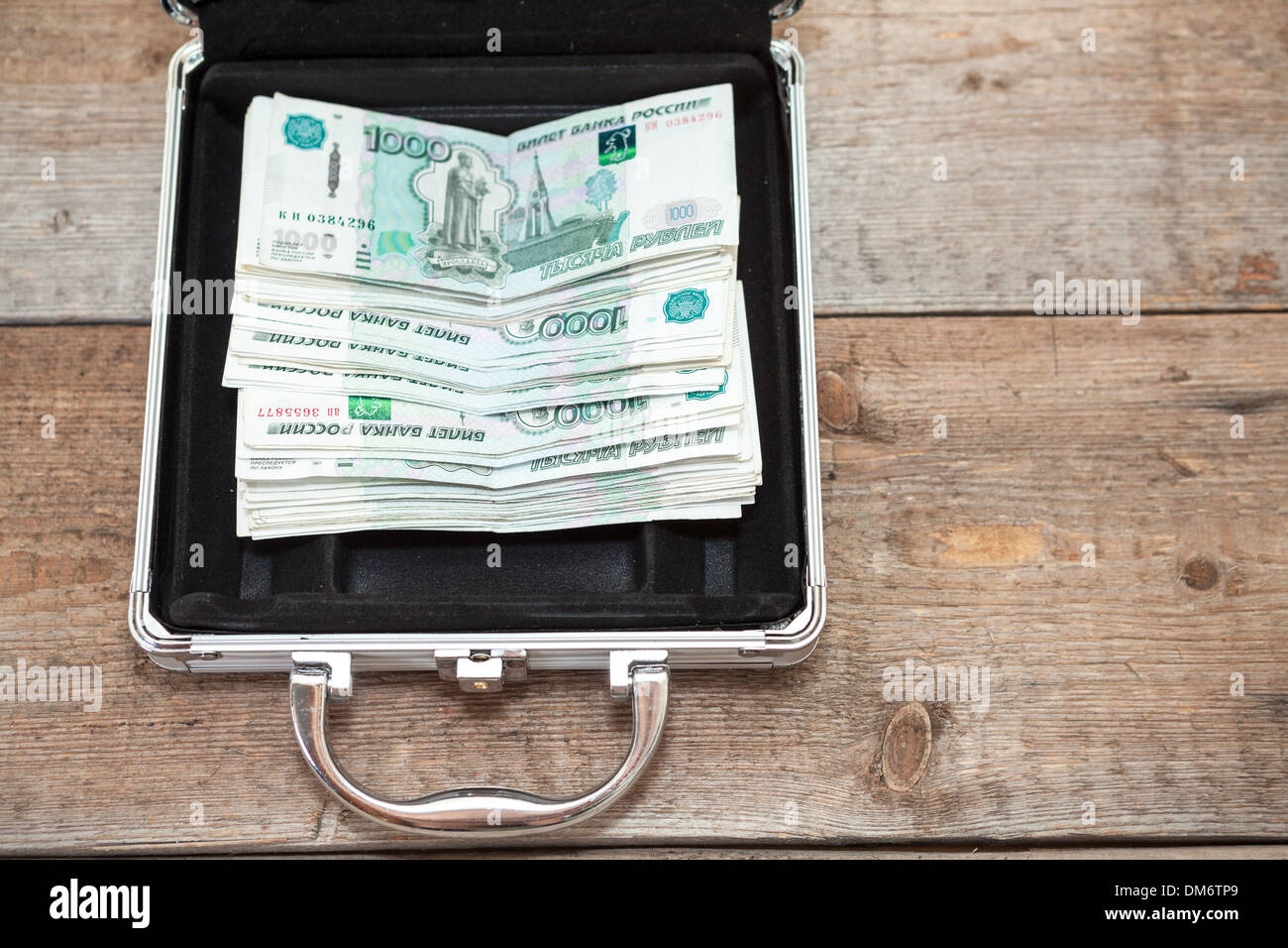 Russian banknotes laid out in order inside of steel case, copyspace ...