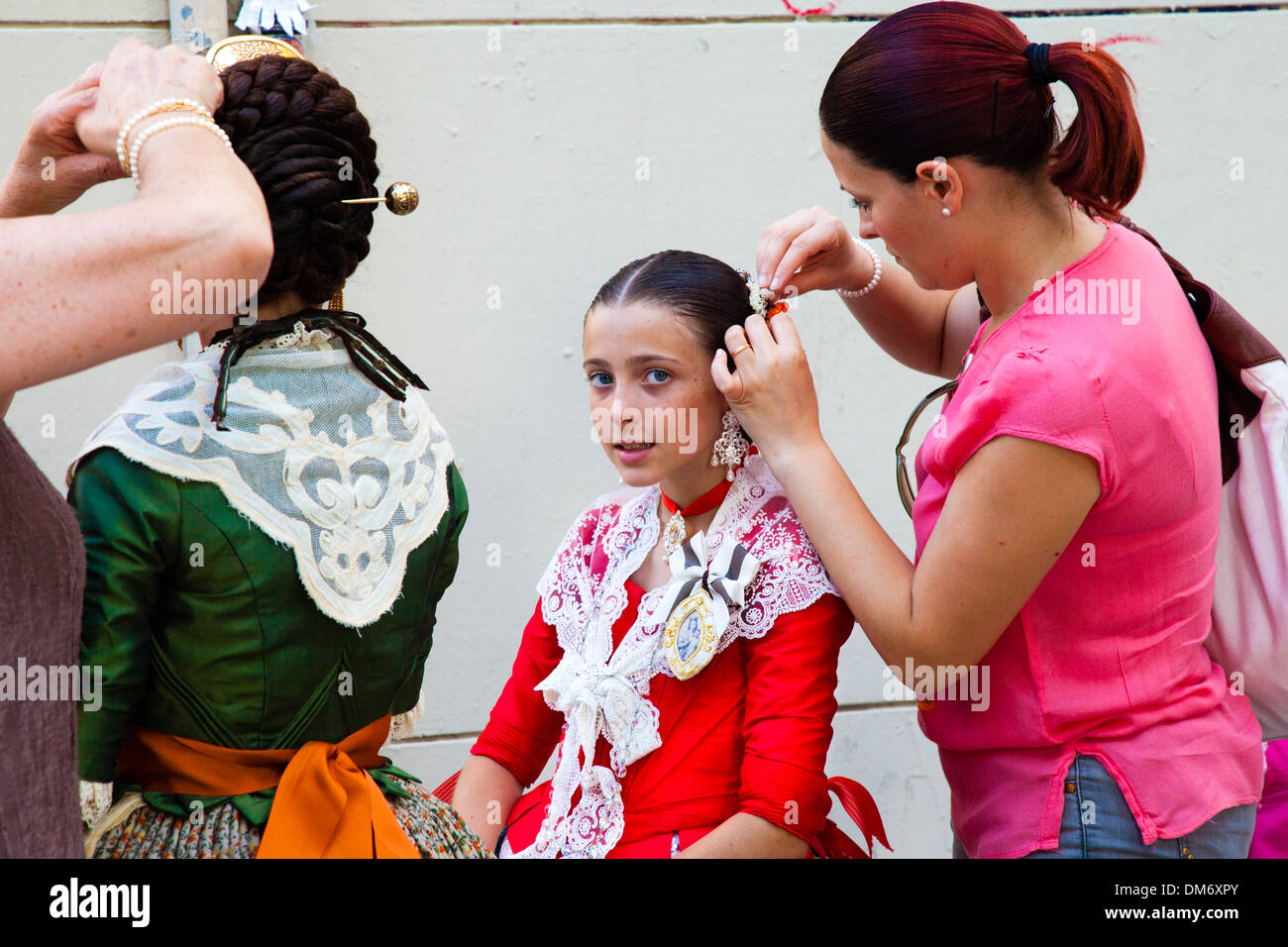 Girls being dressed for local traditional fiesta, Valencia, Spain Stock ...