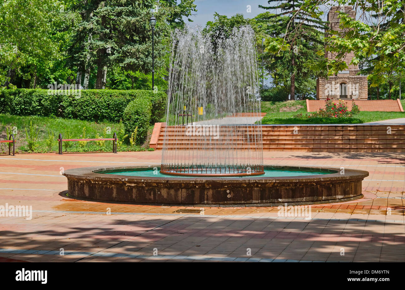 Part of public garden - fountain and monument Stock Photo - Alamy