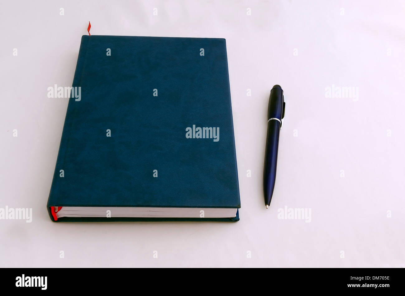 Closed book (notebook) with dark hard-cover and ball-point pen Stock ...