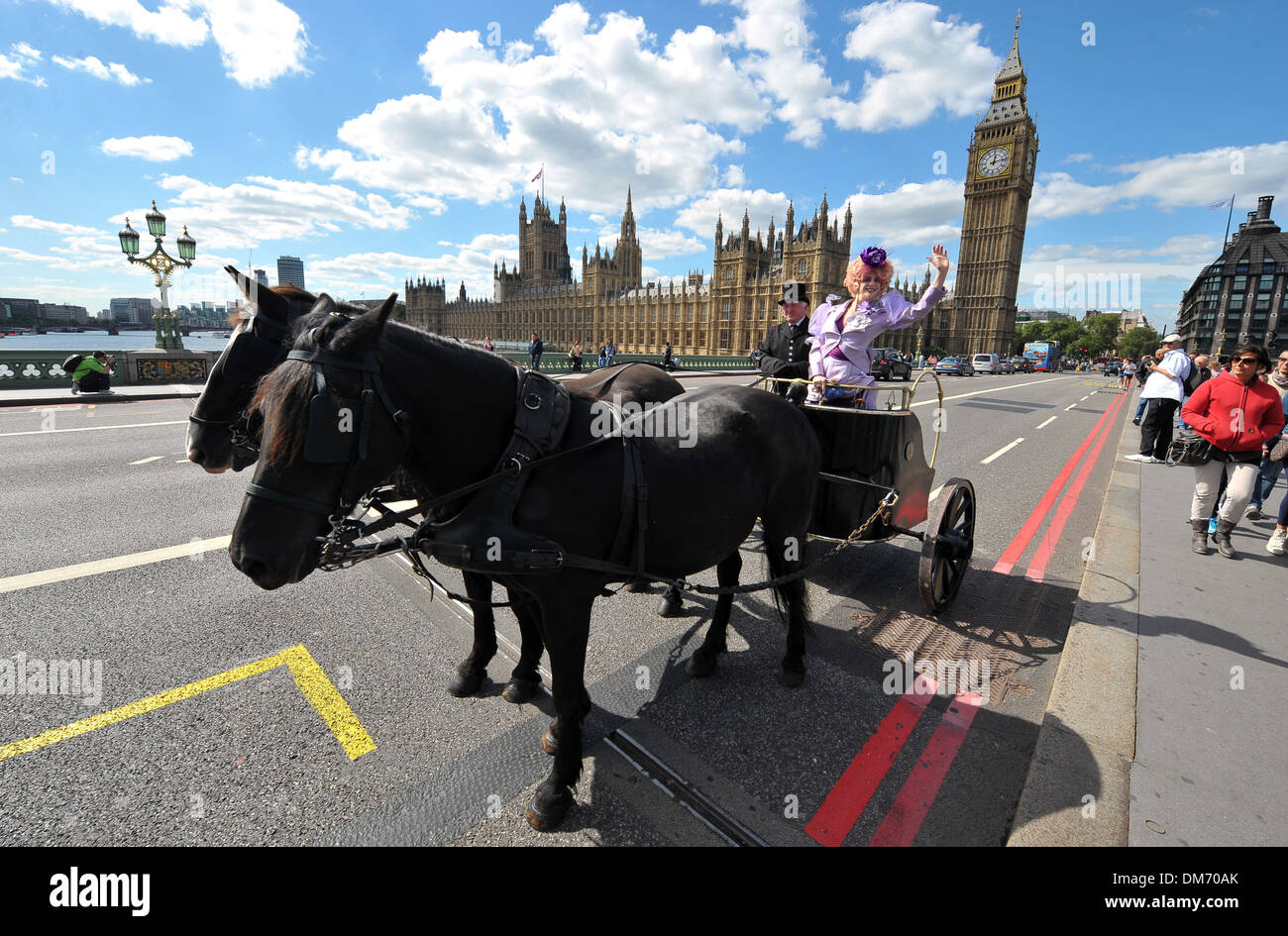 A representative of Capitol (actress Cat Bellamy) waves to fans on ...