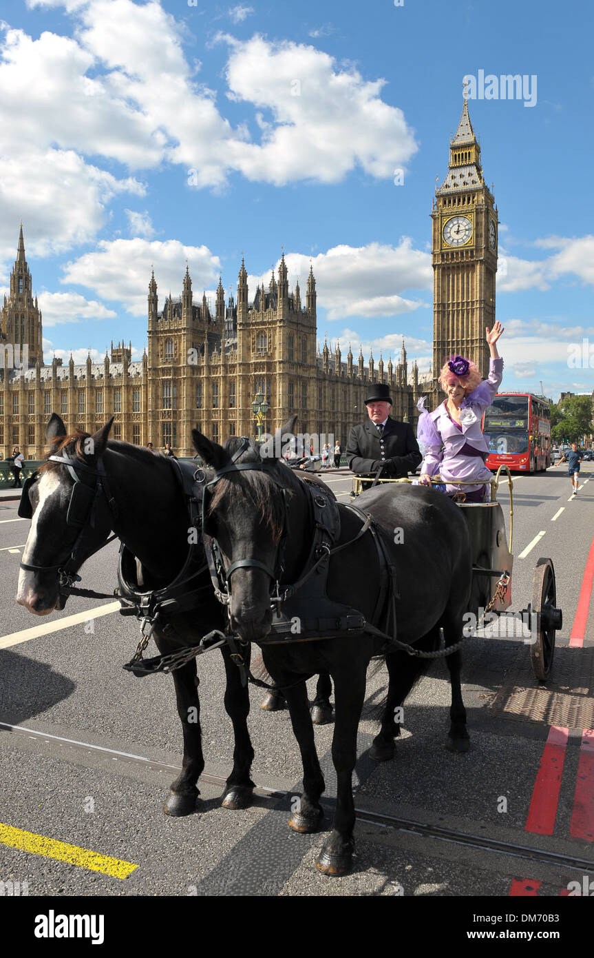 A representative of Capitol (actress Cat Bellamy) waves to fans on ...