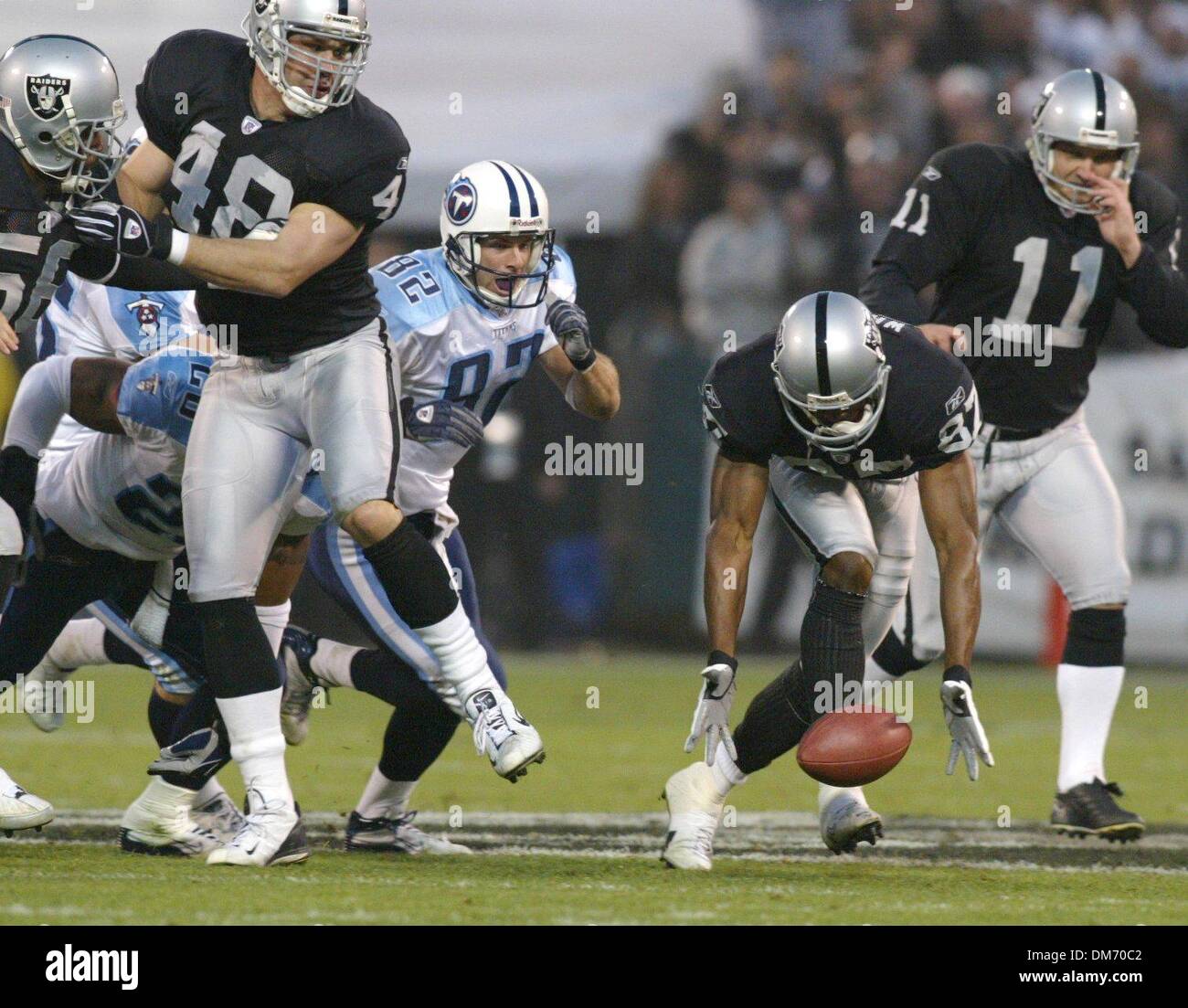 Oakland Raider Alvis Whitted, 87, picks up John Simon's fumble after a ...