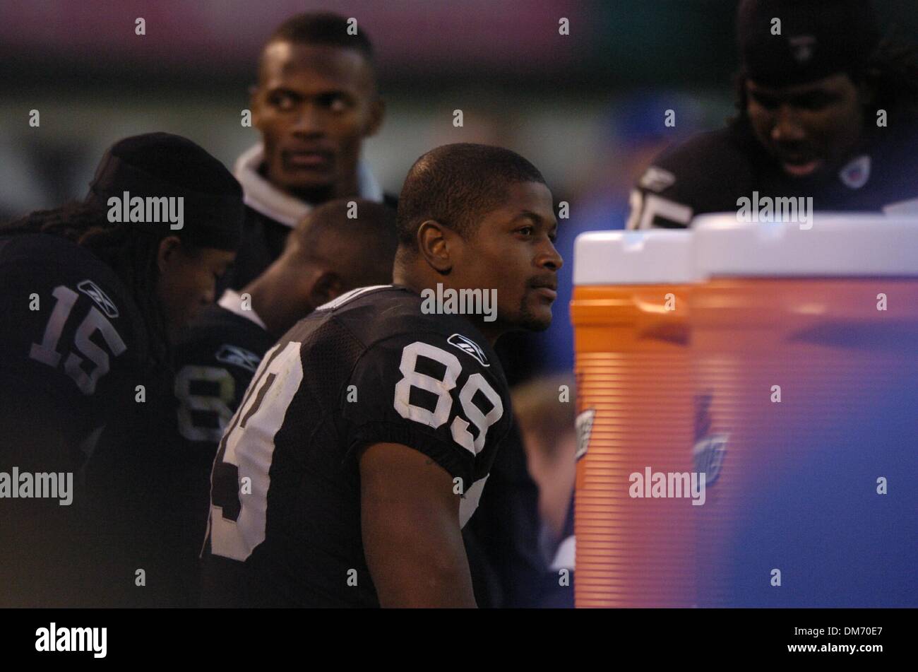 Raider wide reciever Ronald Curry watches from the beanch with tless ...