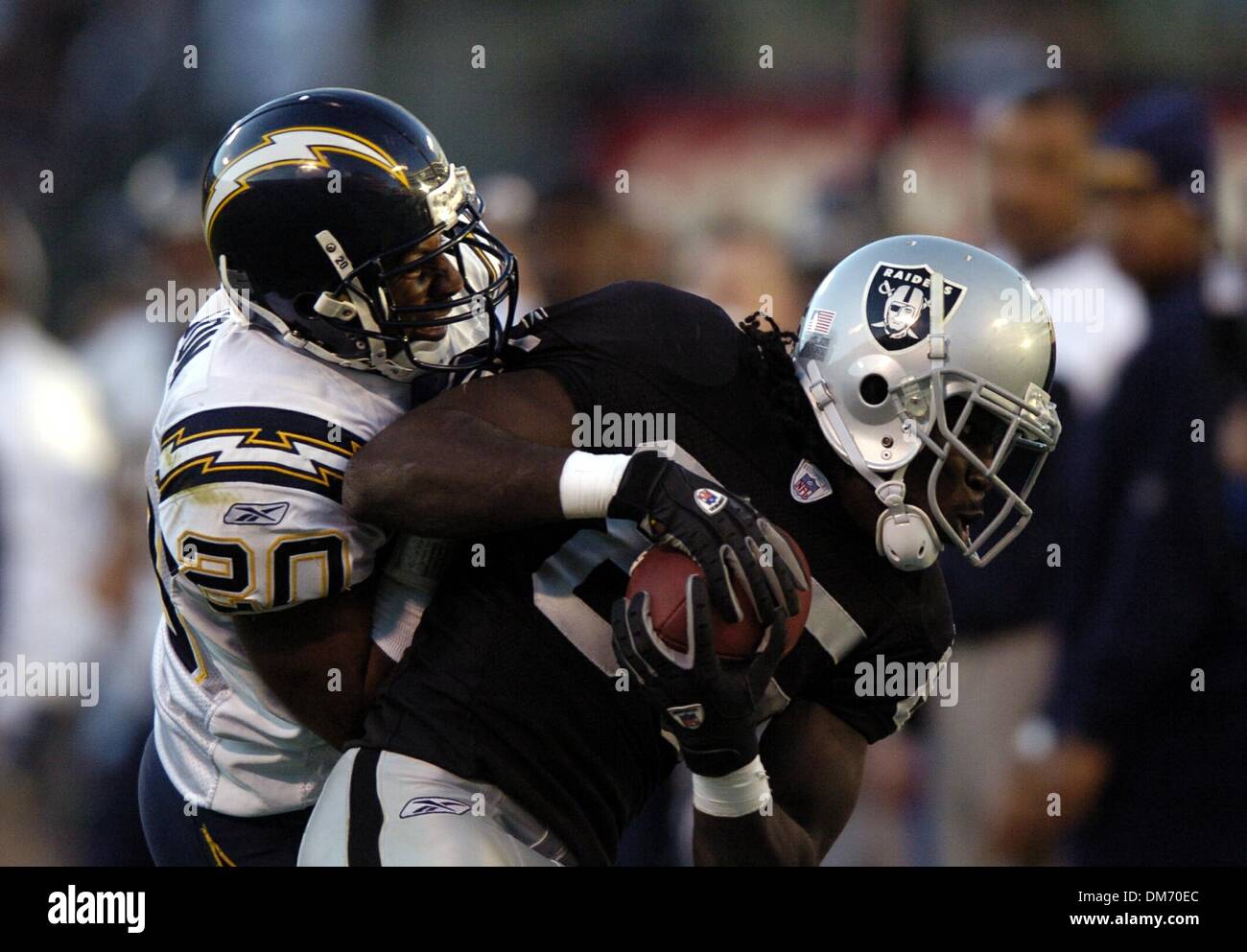 Doug Gabriel haules in a 20 yard pass from Kerry Collins over Charger ...