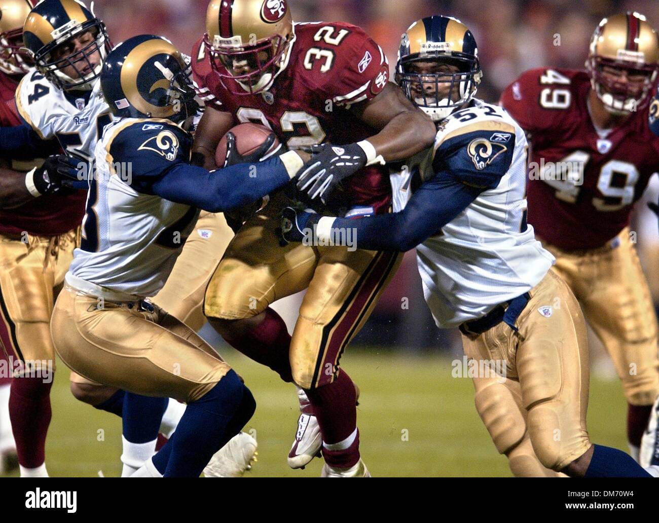 Running back Kevan Barlow (32) of the San Francisco 49ers is tackled by ...