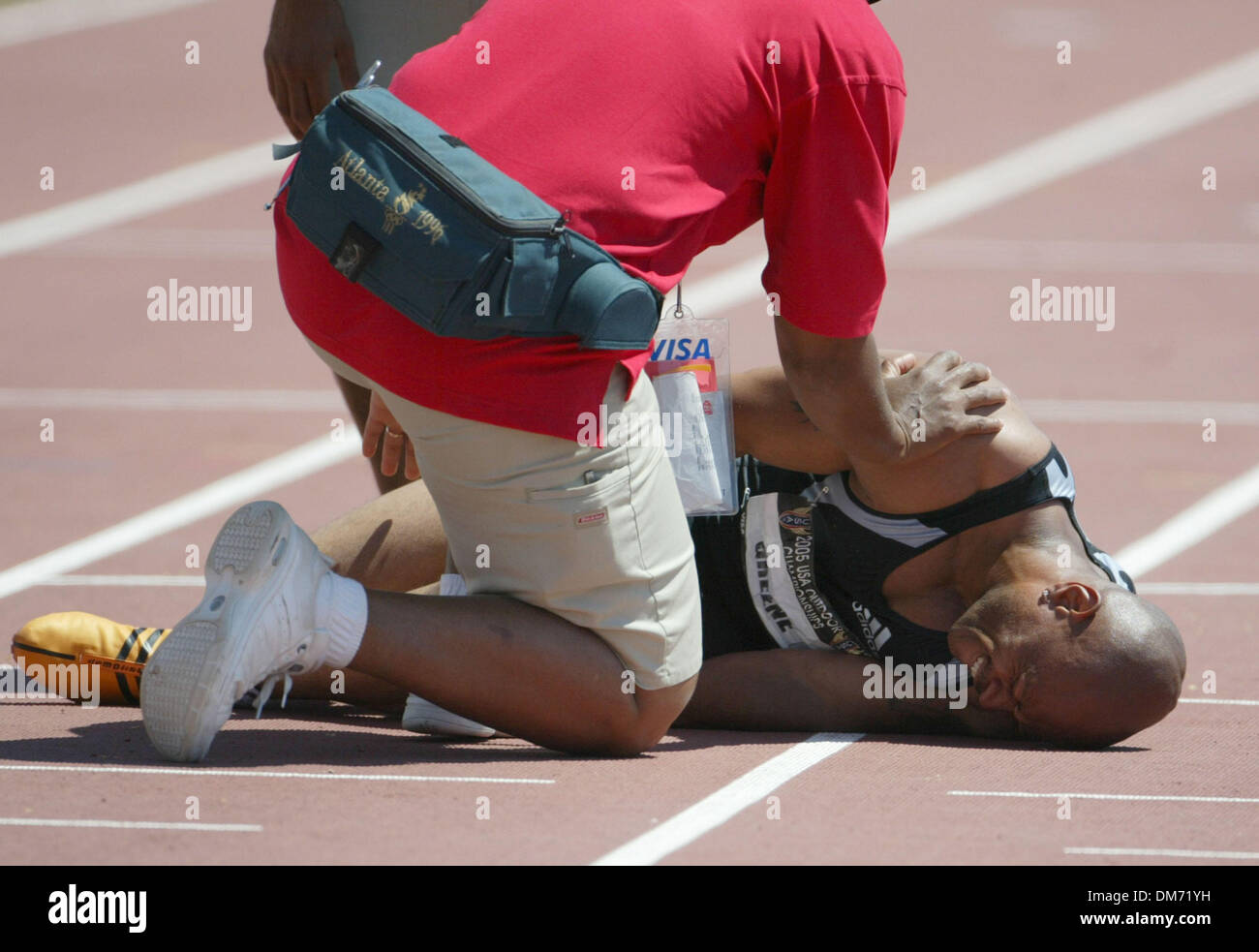Jun 25, 2005; Carson, CA, USA; A first aid worker calls for additional ...