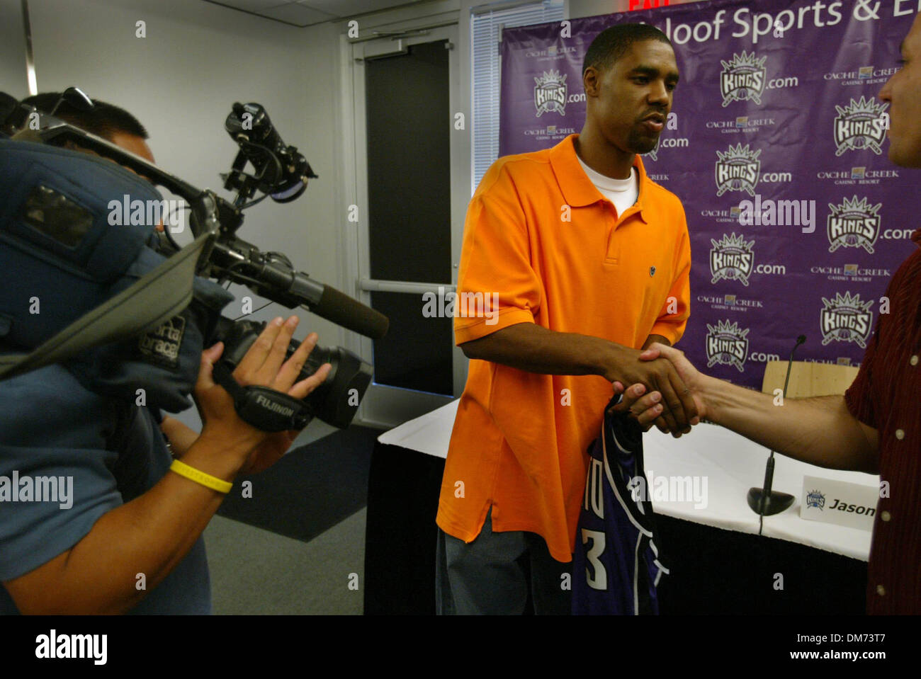 Aug 05, 2005; Sacramento, CA, USA; Holding his Kings Jersey newly ...