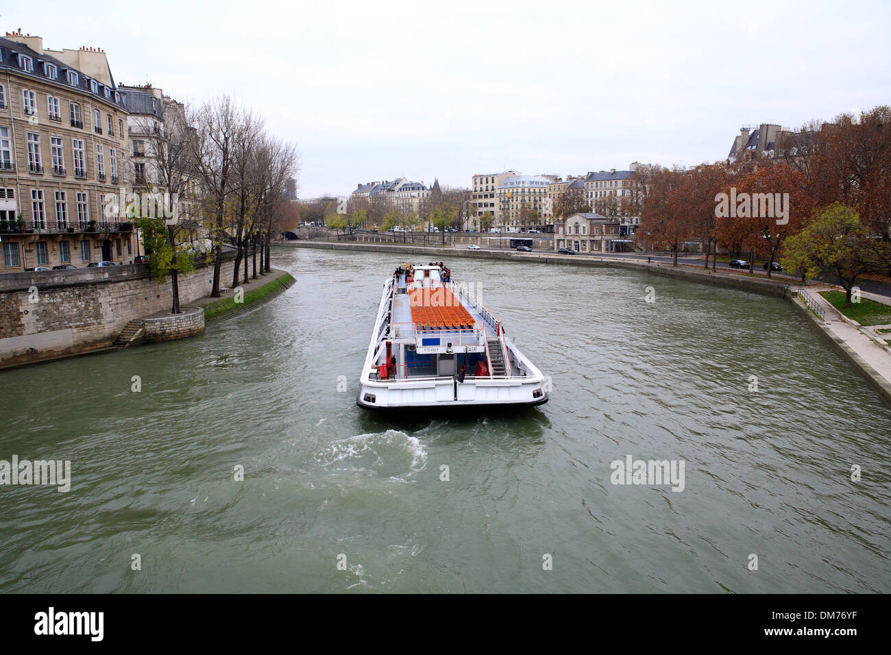 river seine view with tourist sightseeing boat from pont sully bridge ...