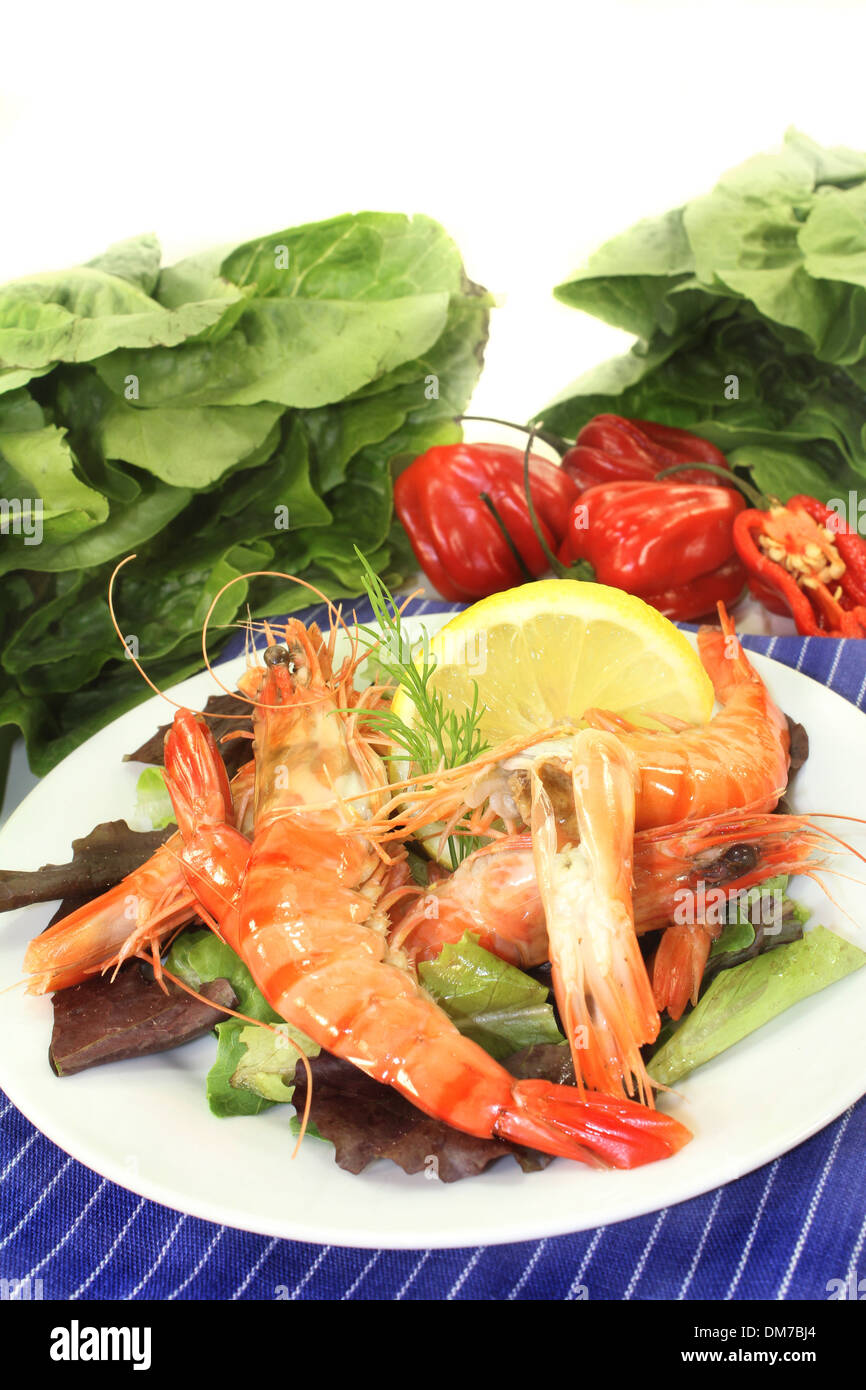 Black Tiger shrimp with lemon on curled lettuce Stock Photo - Alamy