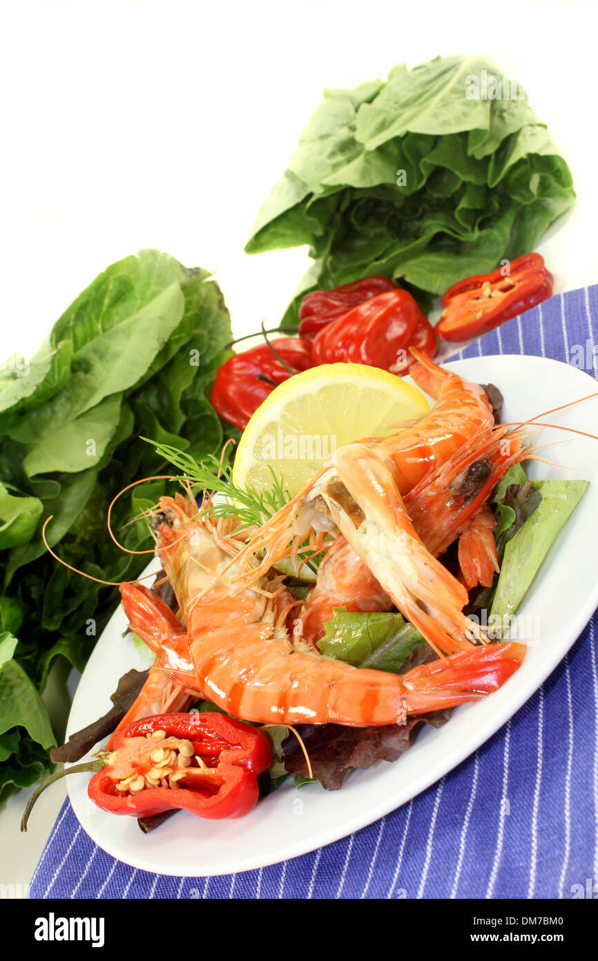 Black Tiger shrimp with lemon on curled lettuce Stock Photo - Alamy