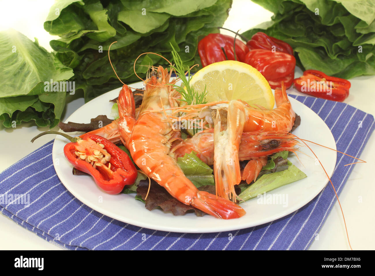 Black Tiger shrimp with lemon on curled lettuce Stock Photo - Alamy