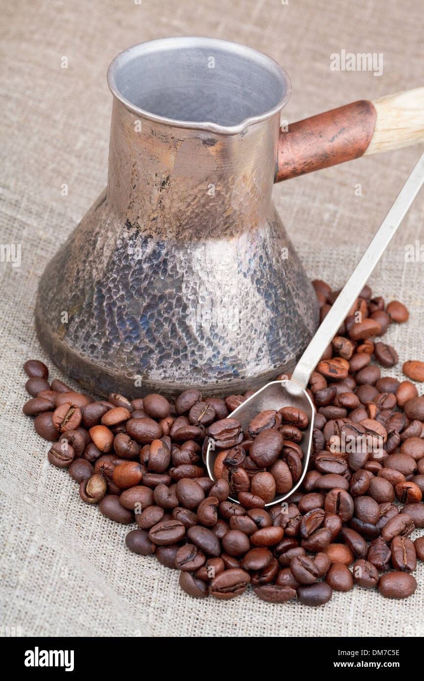 roasted coffee beans and copper coffee pot close up on bagging Stock ...