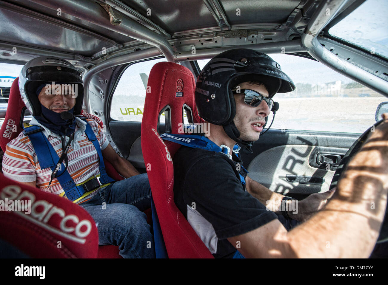 MONITOR AT THE WHEEL AND HIS PUPIL DURING AN INTRODUCTORY RACE, PRO ...