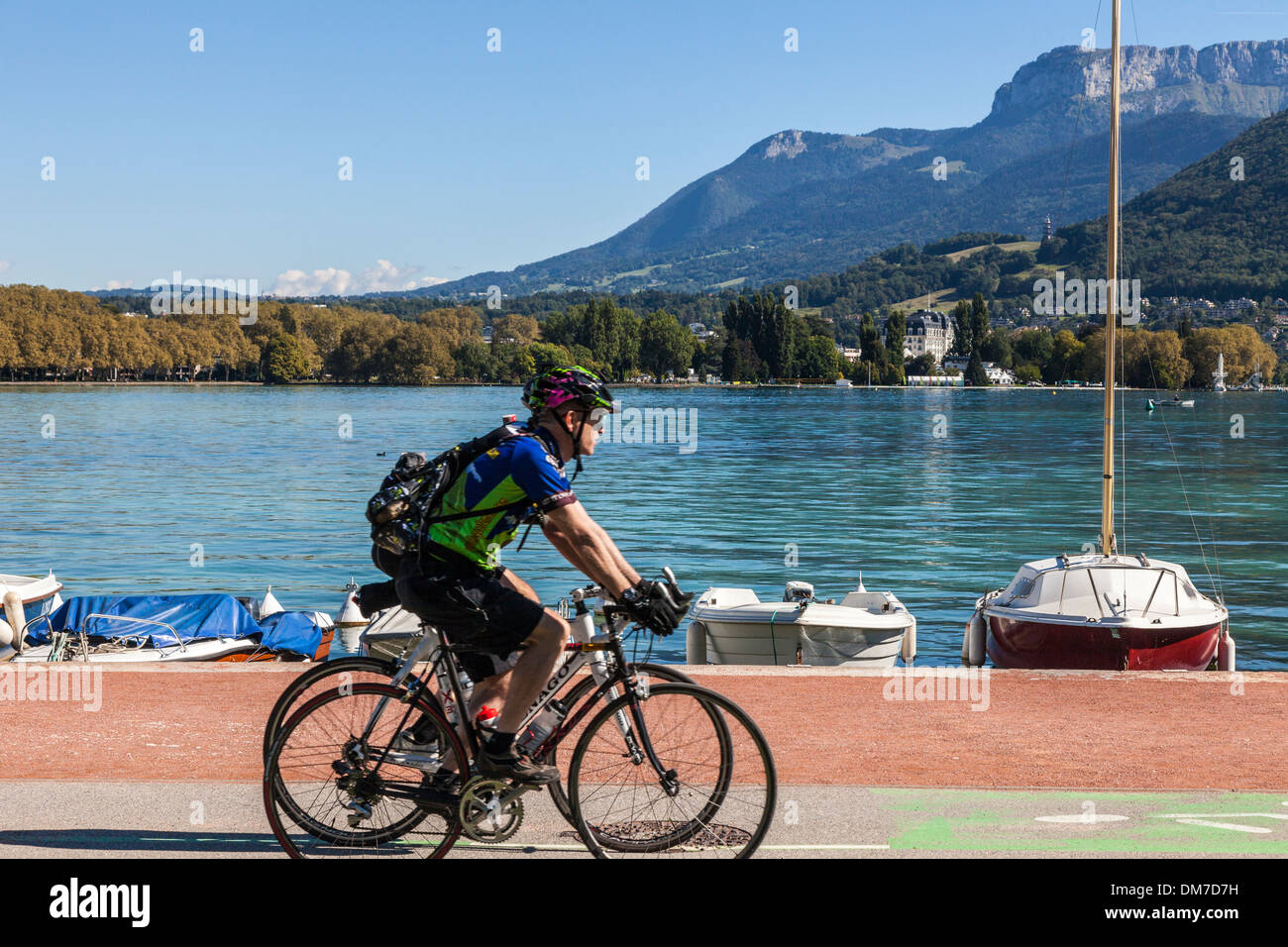Cycling path and cyclists around Lake Annecy, Savoie, France Stock ...