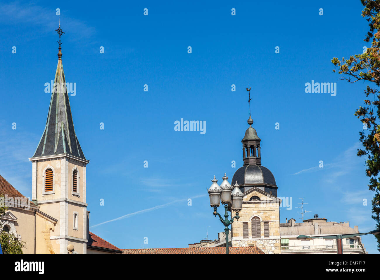Church bell tower and ornate lamps, Annecy, Savoie, France Stock Photo ...