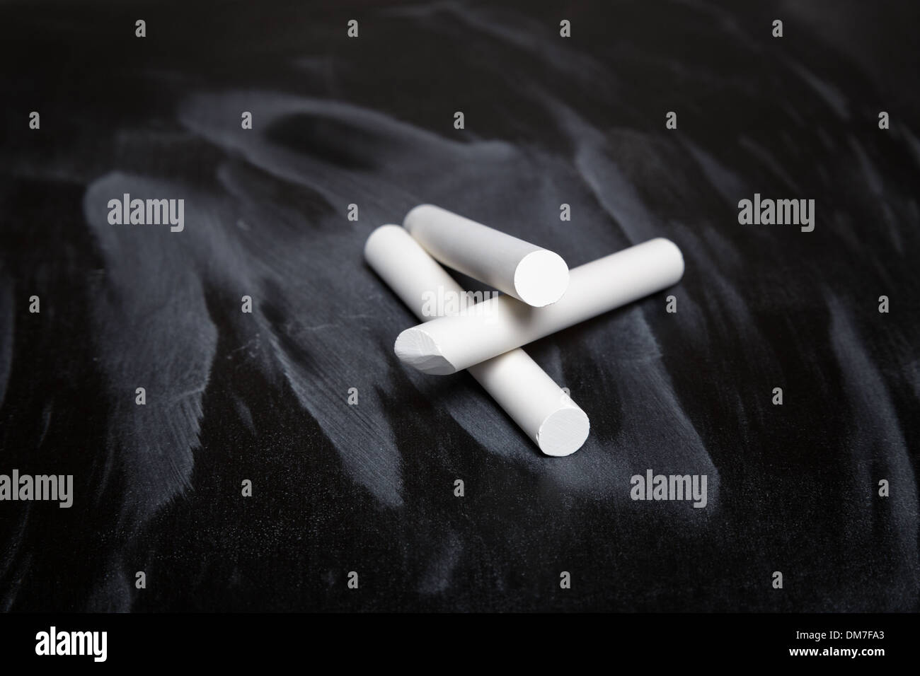 round pices of chalk on the blackboard, school theme Stock Photo - Alamy