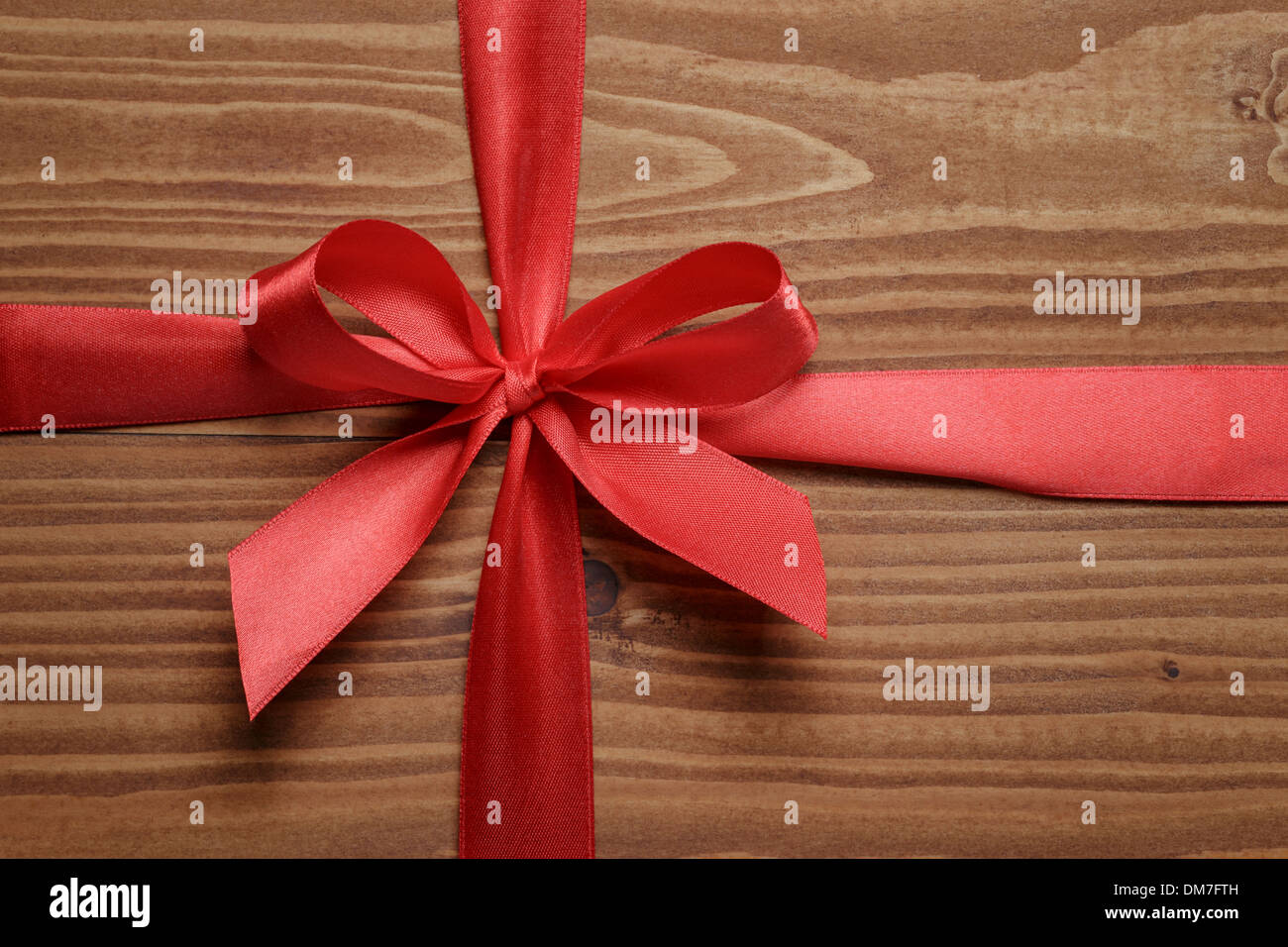 tied ribbon bow on wood plank, vintage style Stock Photo - Alamy