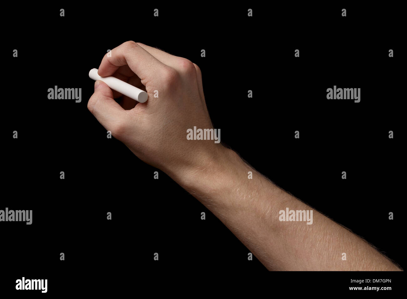 adult man hand with chalk to write something, isolated on black Stock ...