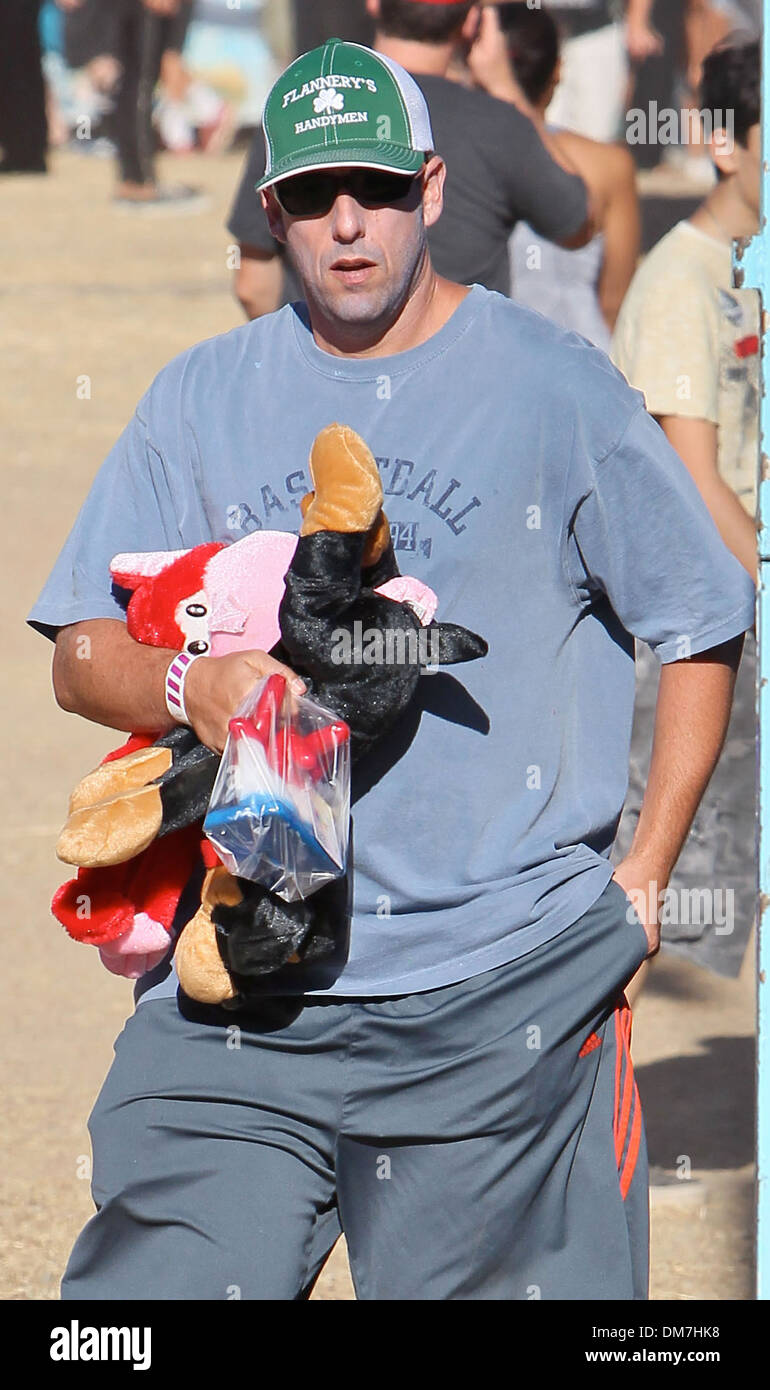 Adam Sandler with his face covered with a thick application of sun ...