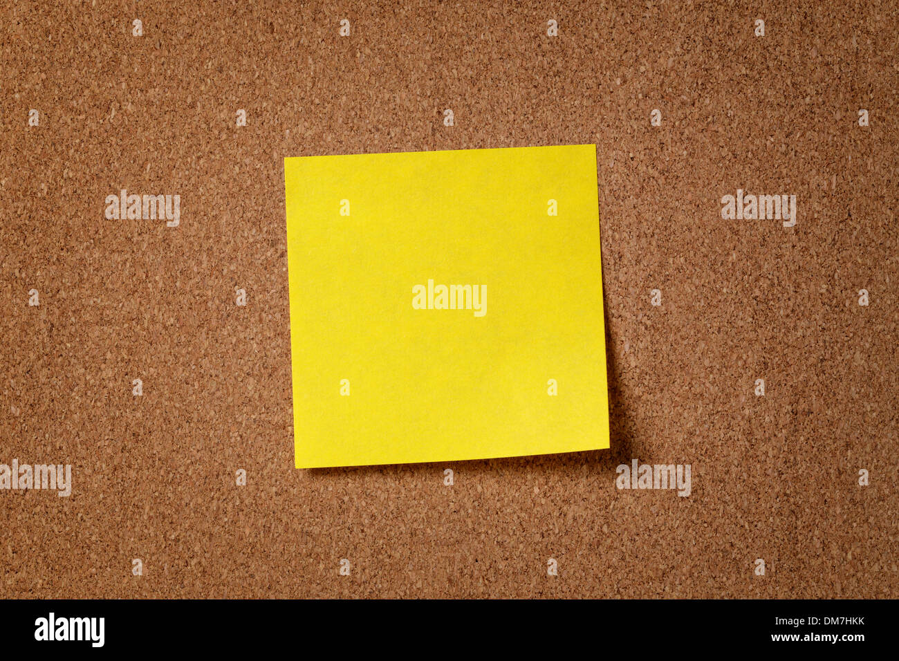 yellow reminder sticky note on cork board, empty space for text Stock ...