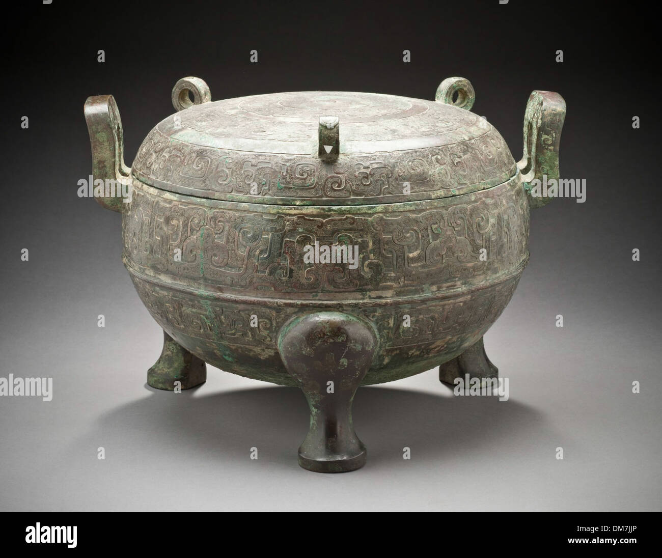 This lidded ritual food cauldron, known as a Ding, is adorned with ...