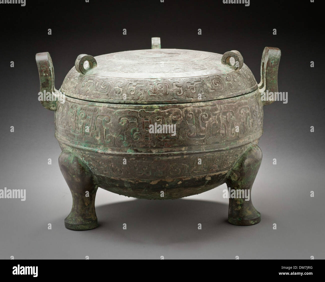 This ritual food cauldron, or Ding, is adorned with interlaced dragon ...