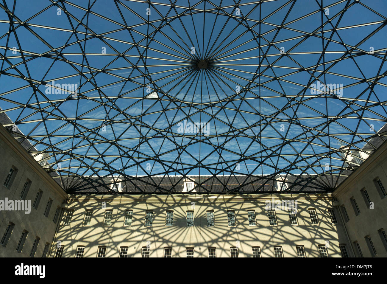 Glass roof designed as a compass card casts geometrical shadows on ...