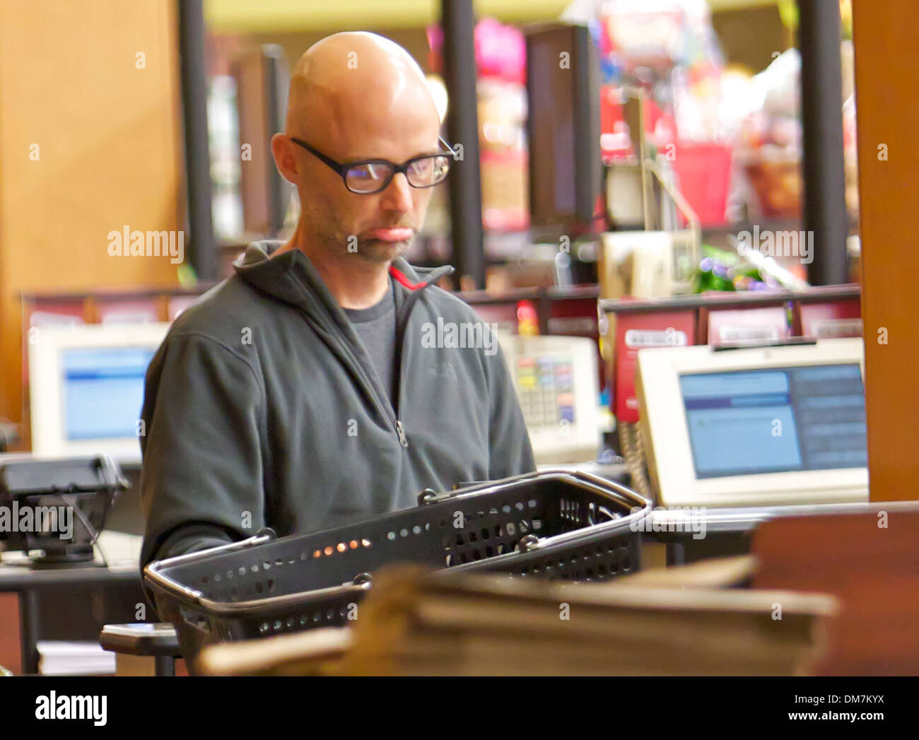 Moby pulls a funny face while paying for his shopping bill at Gelson's ...