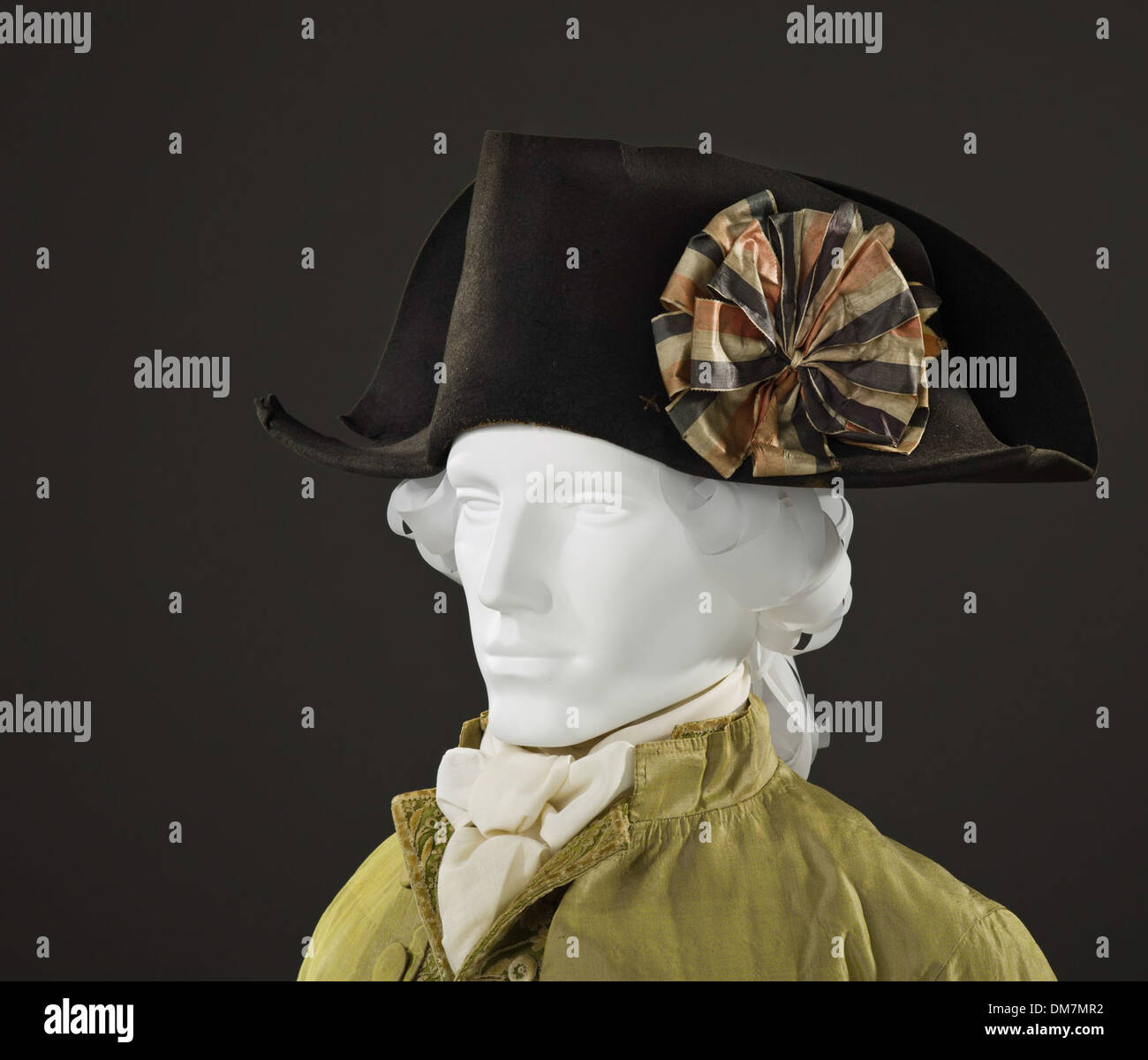 This bicorne hat, typically worn by men in the late 18th and early 19th ...