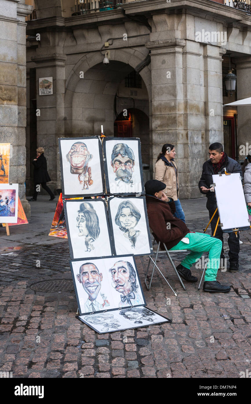 Street artists with cartoons for tourist souvenirs in Madrid, Spain ...