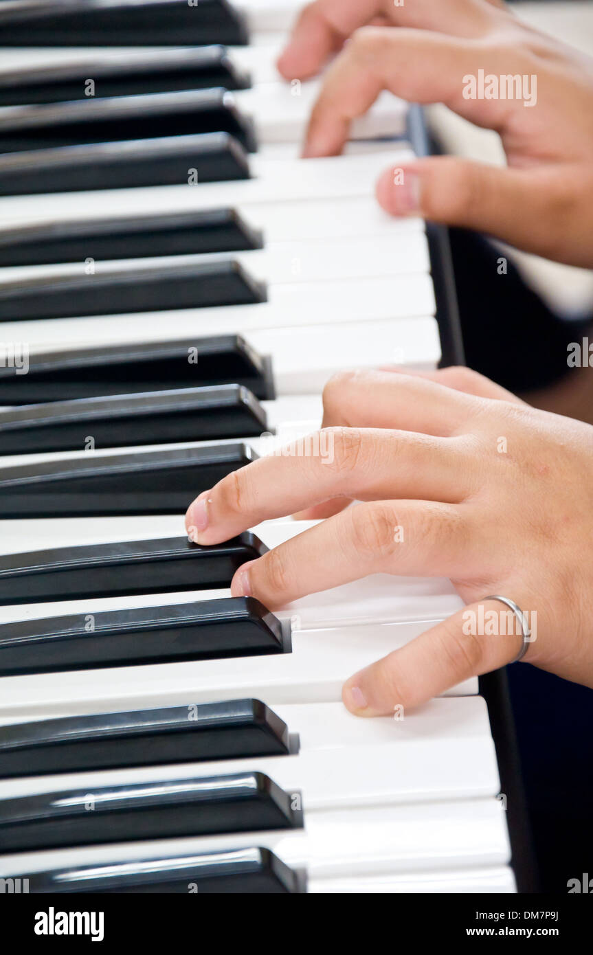 hand for play keyboard and music Stock Photo - Alamy