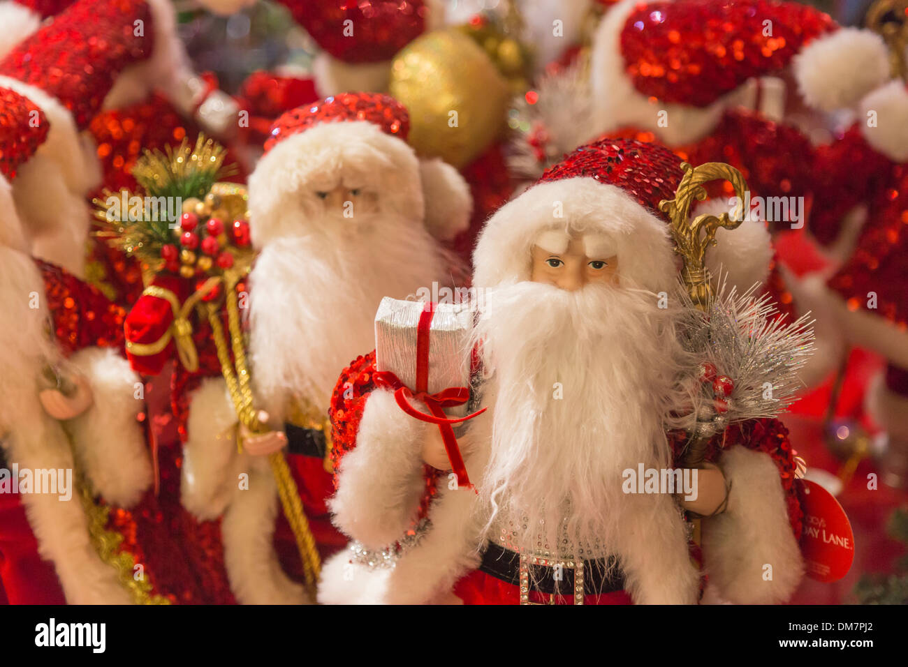 Father Christmas (Santa Claus) figures with traditional red costume and ...