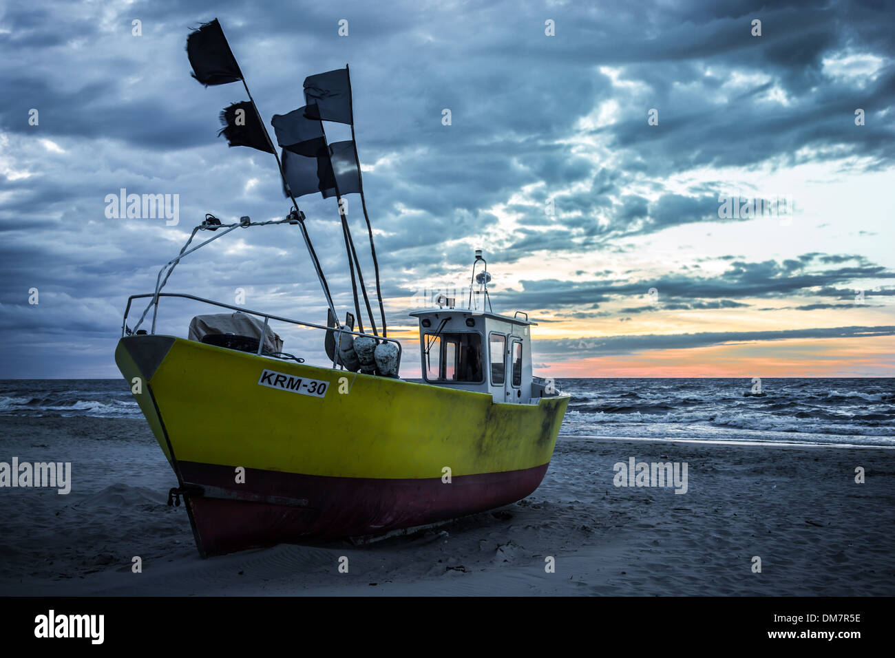 Fishing boat at a beach Stock Photo - Alamy