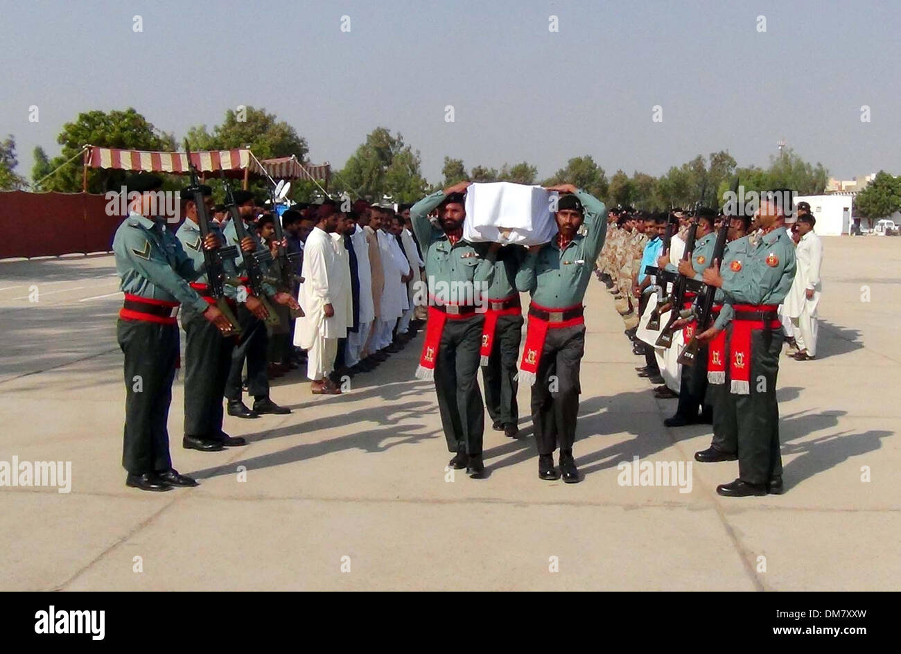 Karachi, Pakistan. 12th Dec, 2013. Rangers officials carrying coffin of ...