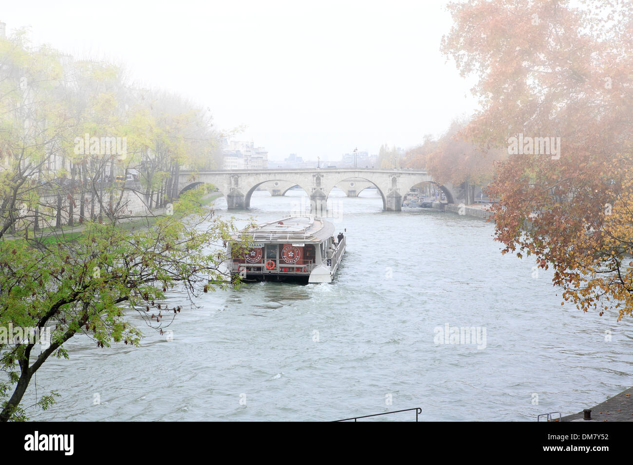 river seine view with tourist sightseeing boat from pont sully bridge ...