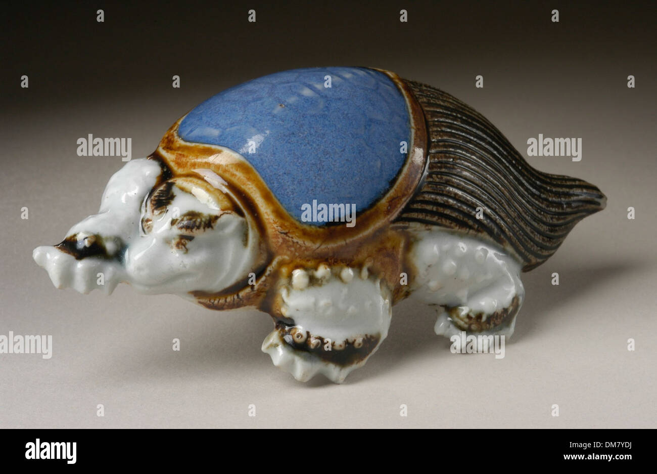 This nail cover is crafted in the shape of a long-tailed turtle ...