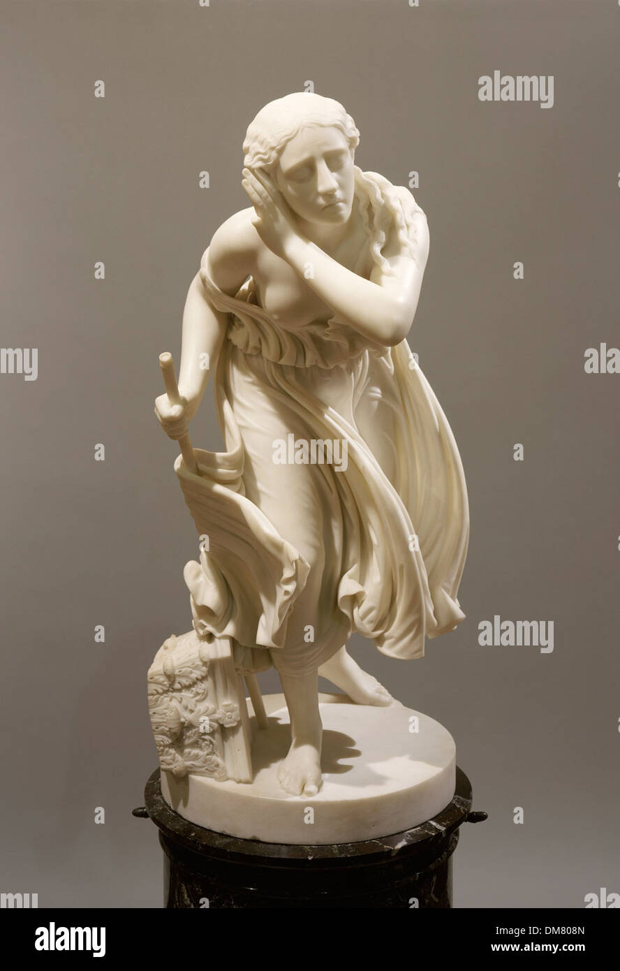 This sculpture depicts Nydia, a blind flower girl from Pompeii, drawn ...