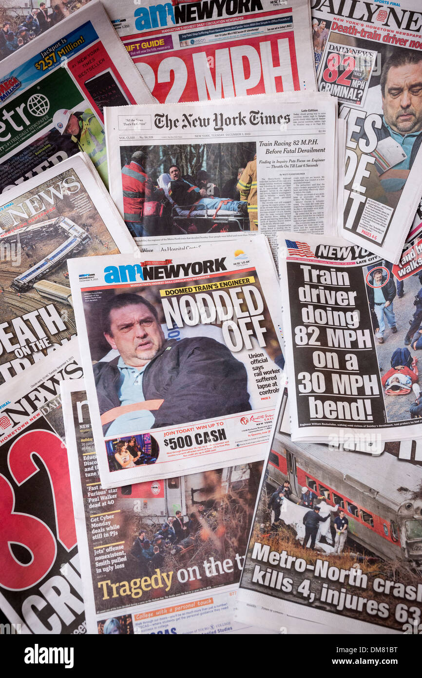 Front pages of New York newspapers report on the derailment of a ...