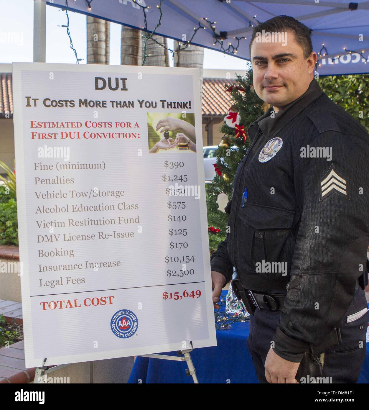 Los Angeles, California, USA. 12th Dec, 2013. A police officer poses ...