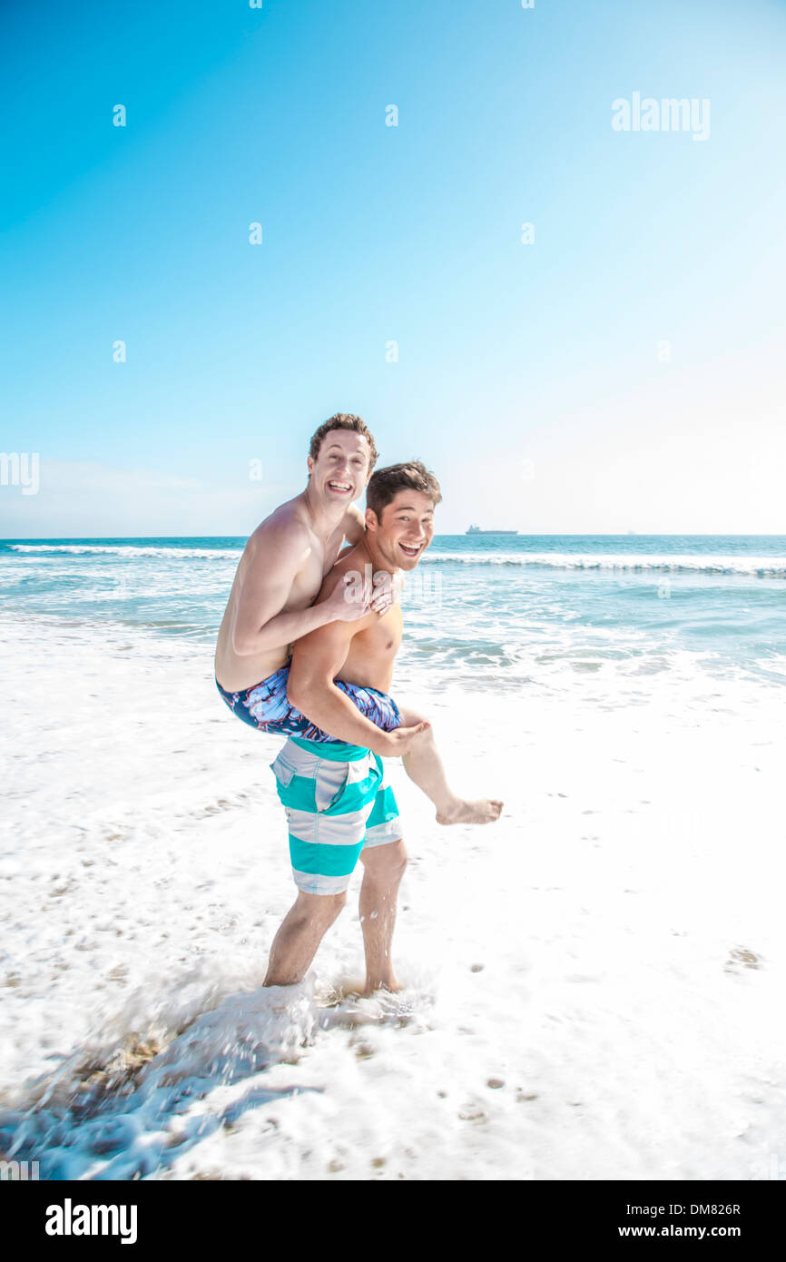 Piggy back ride beach hi-res stock photography and images - Alamy